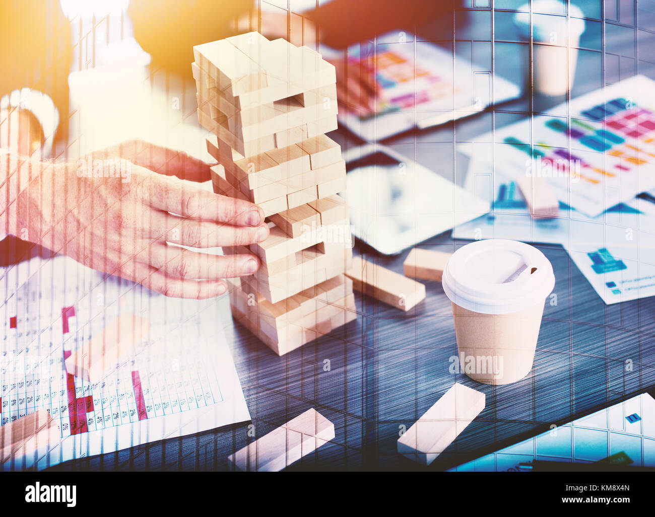 Team of business people build a wooden construction. concept of ...