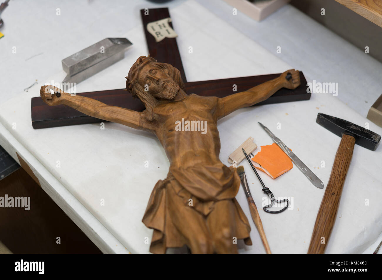 A wooden Crucifix while restoration Stock Photo - Alamy