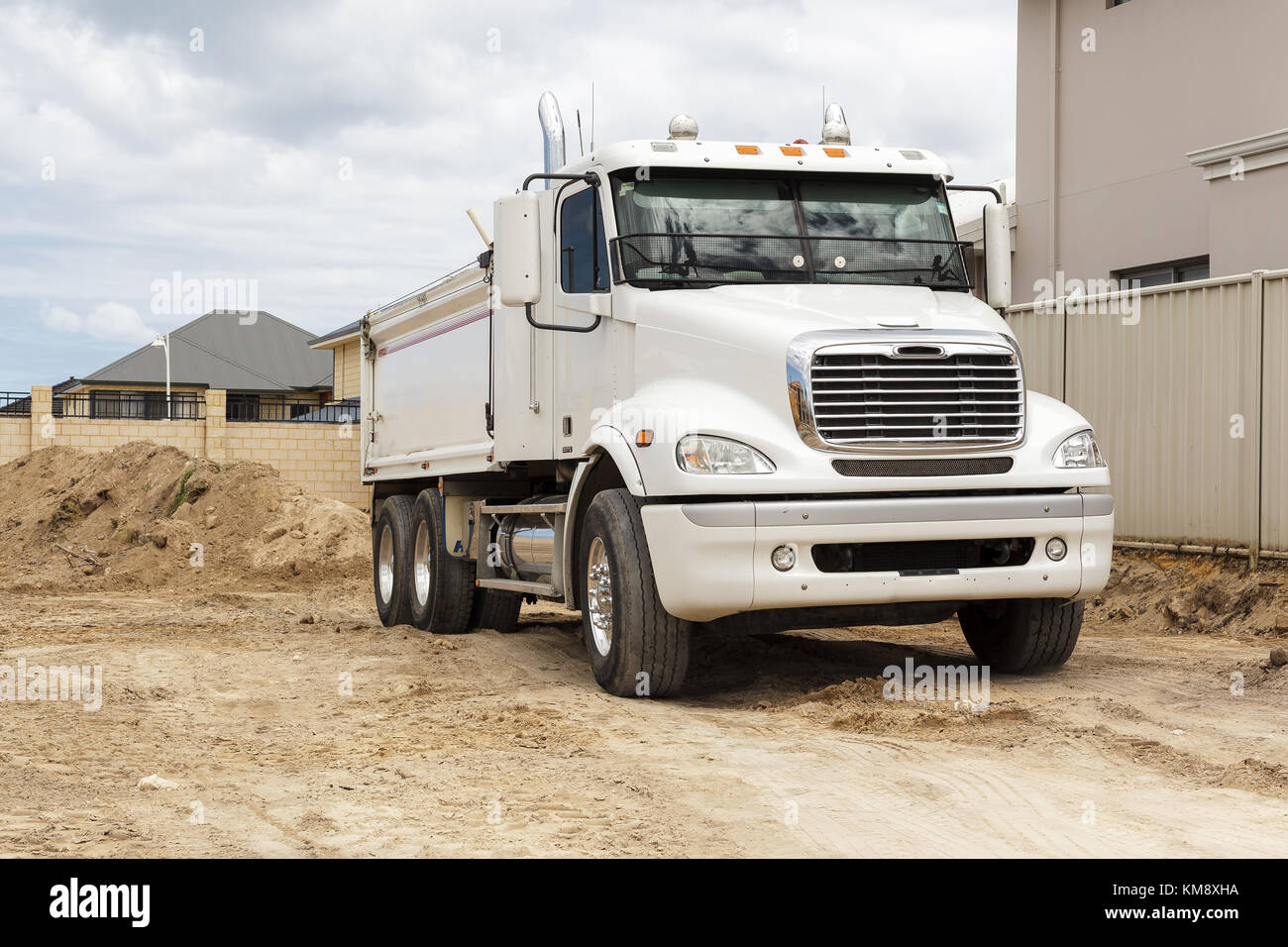 Tip truck standing front perspective Stock Photo - Alamy