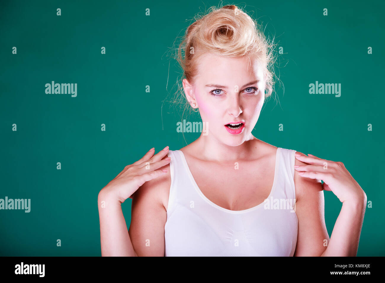 Face expression, emotions concept. Young woman with pin up hair being ...