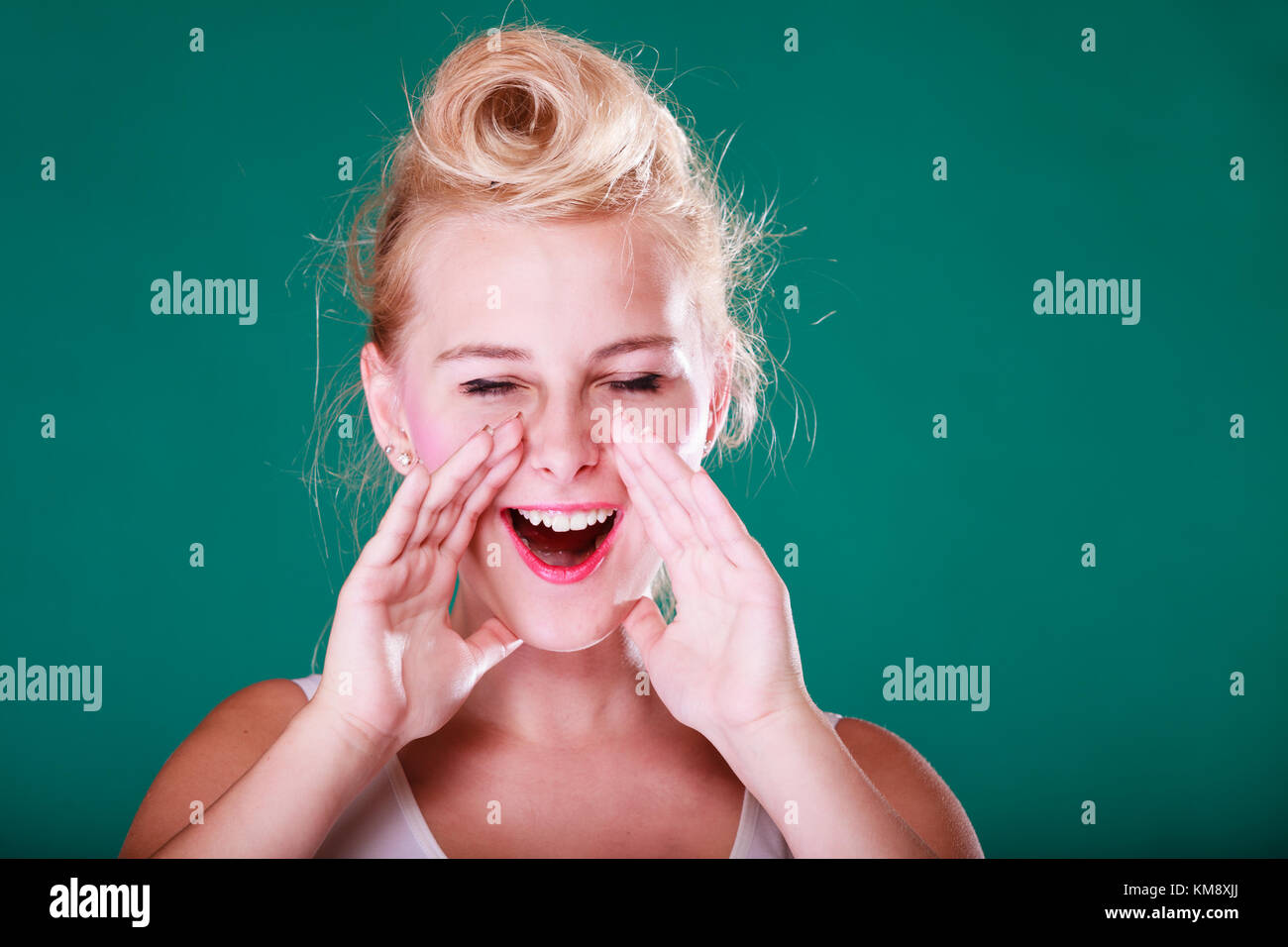 Yelling gestures concept. Lovely pin up girl screaming with hands close ...