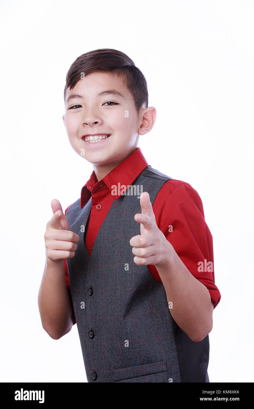 A confident young boy gives a cool finger point to the camera Stock ...