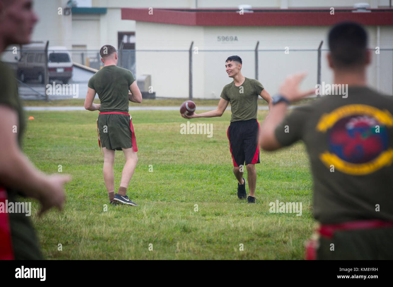 u.s. marines with marine wing support squadron 172 toss a football to ...