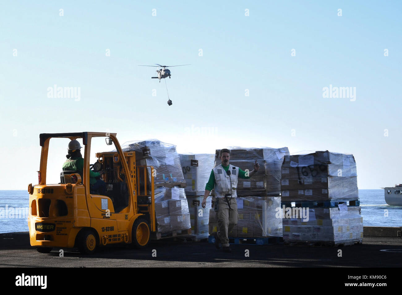 Logistics Specialist 2nd Class Dorthea Wright drives a forklift while ...