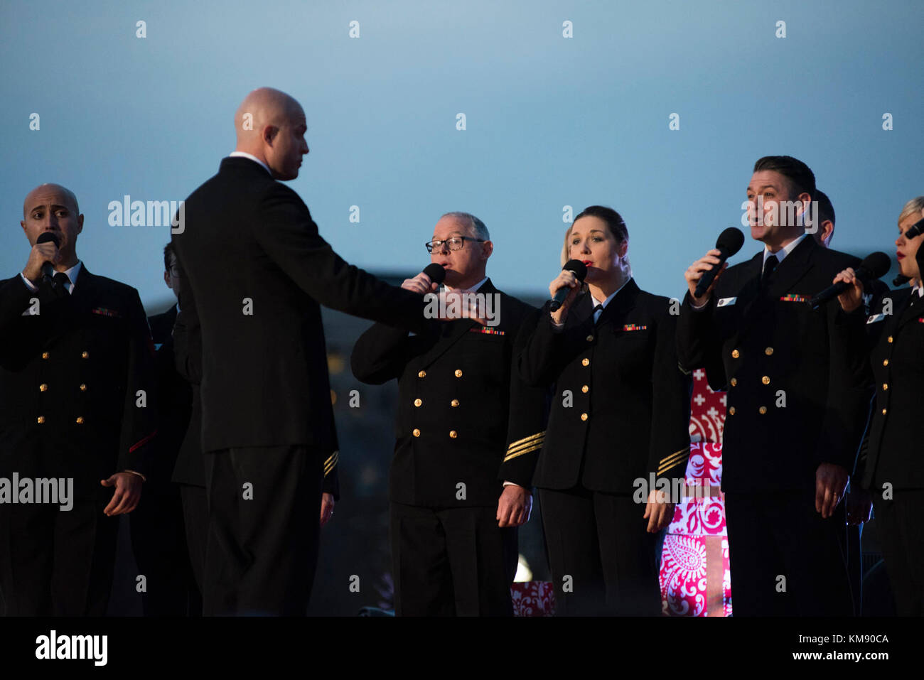 Musician 1st Class Benjamin Bransford, left, leads members of the U.S ...