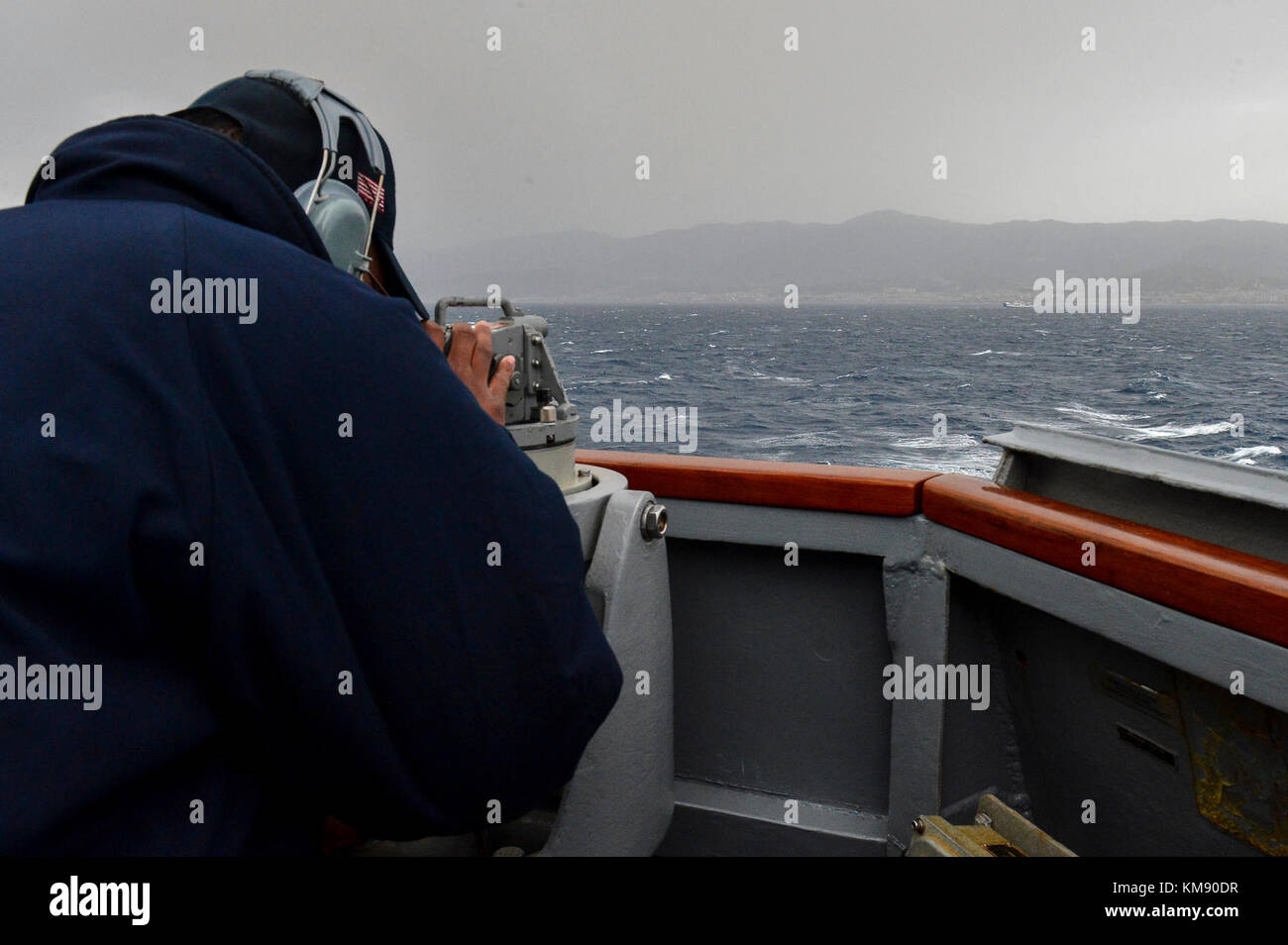 Quartermaster 3rd Class Donald Felton reads relative bearing using an ...