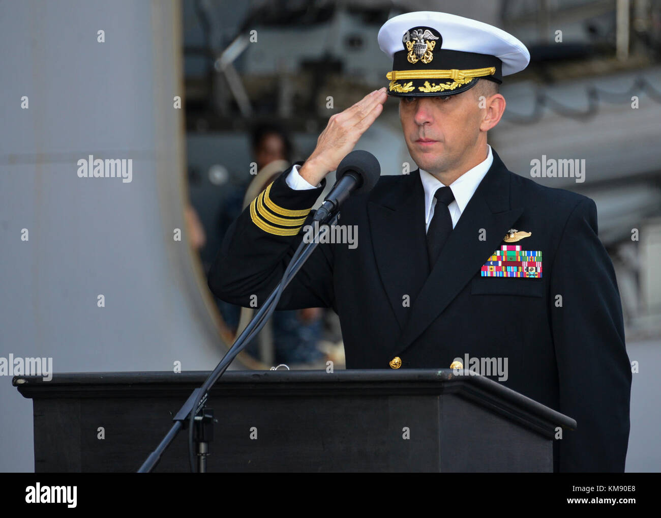 Cmdr. Paul Tremblay, a chaplain, salutes as service members’ cremains ...
