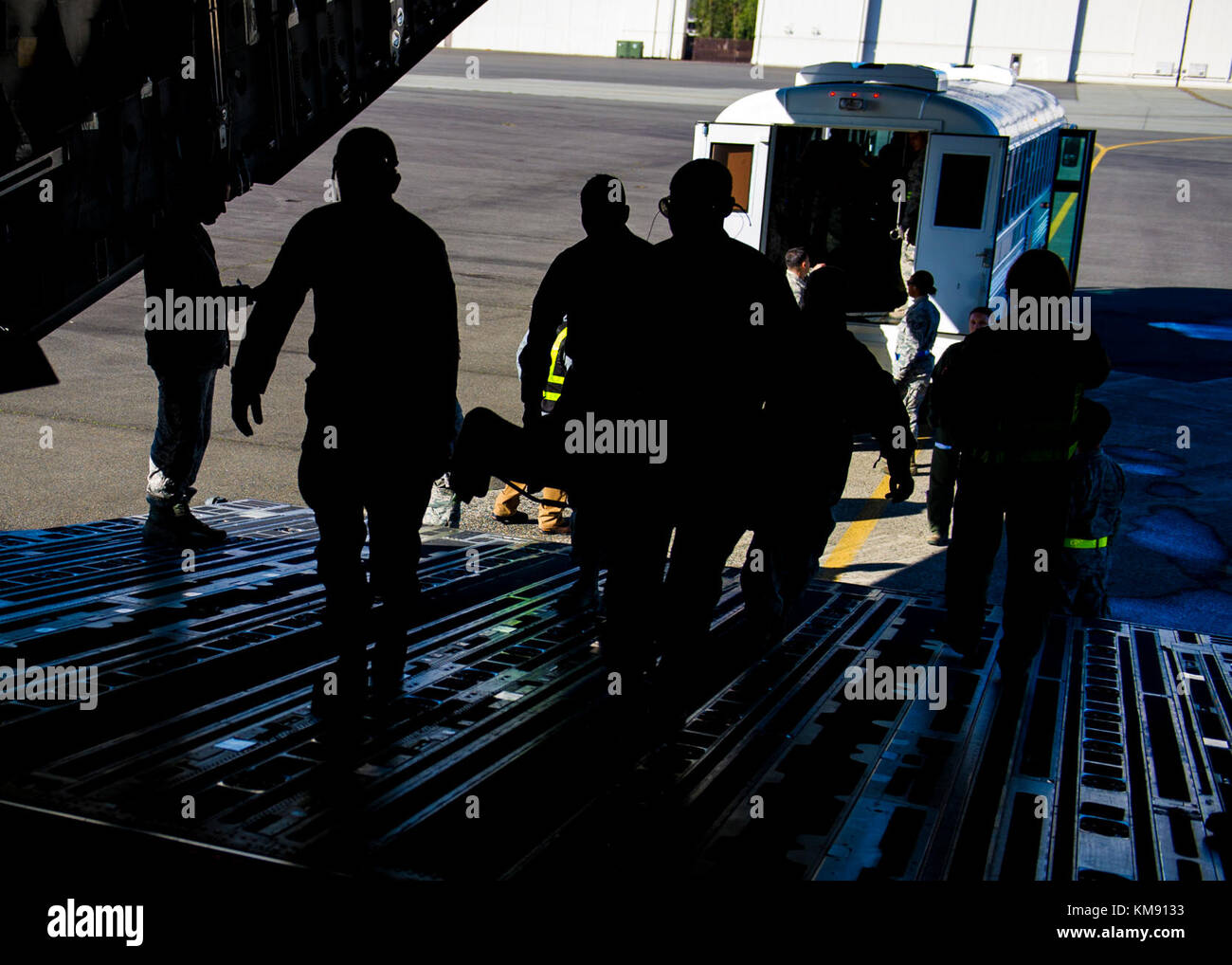 Airmen from the 446th Aeromedical Staging Squadron, carry a litter with ...