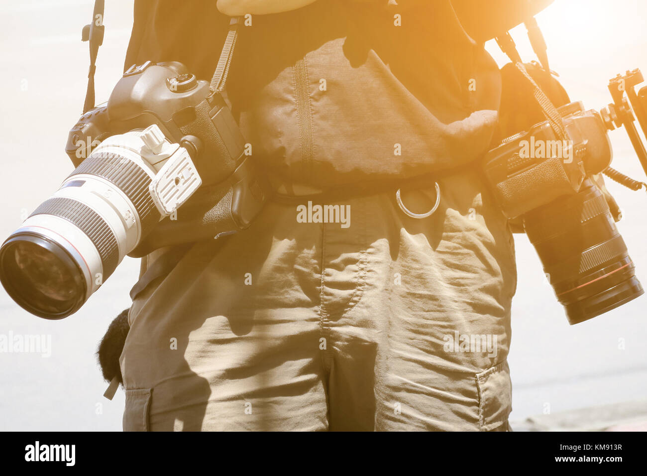 Cameraman with his video camera shooting Stock Photo - Alamy