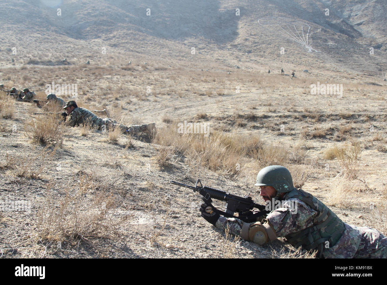 An Afghan soldier scans his security sector during a patrolling class ...
