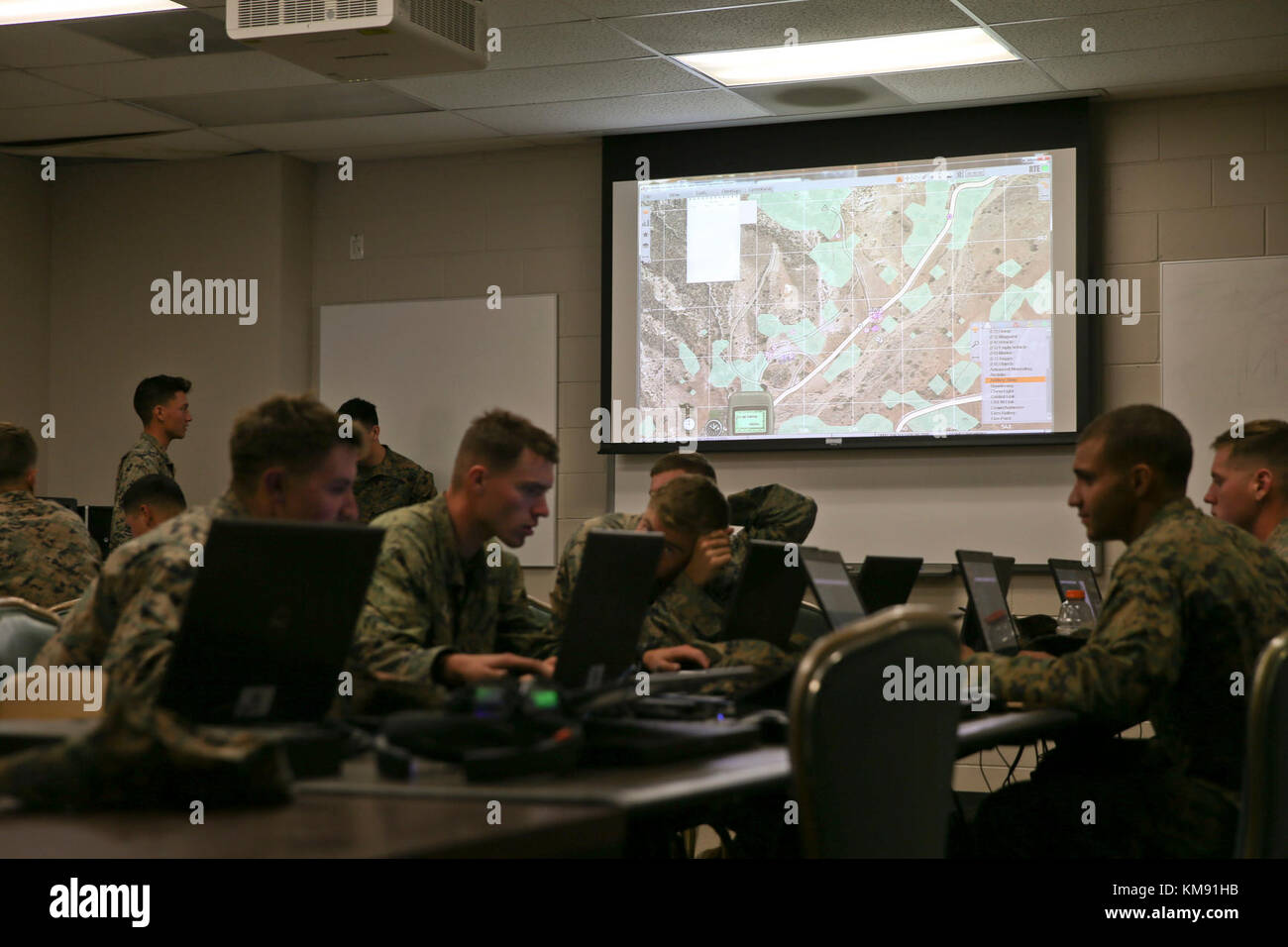 U.S. Marines attending the Infantry Unit Leaders Course study the ...