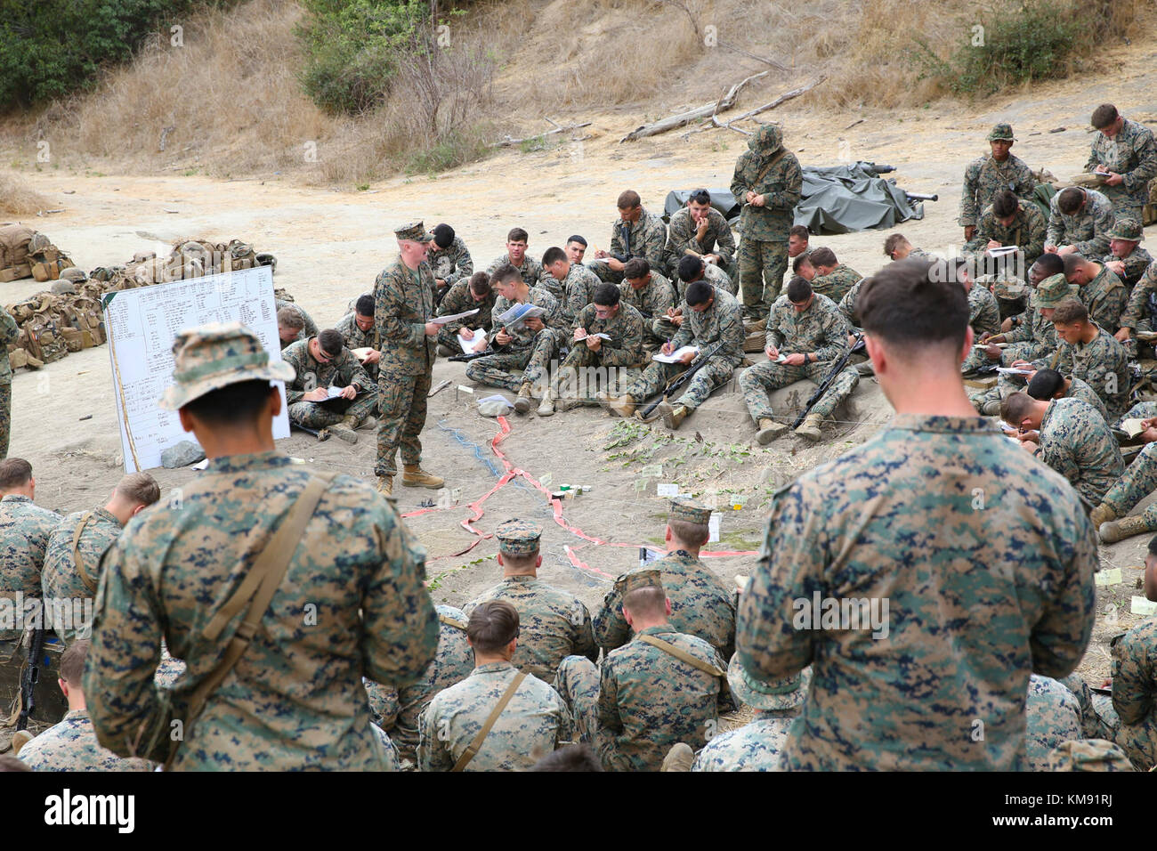 U.S. Marine Corps Capt. Nicholas Leads conducts a sand-table exercise ...