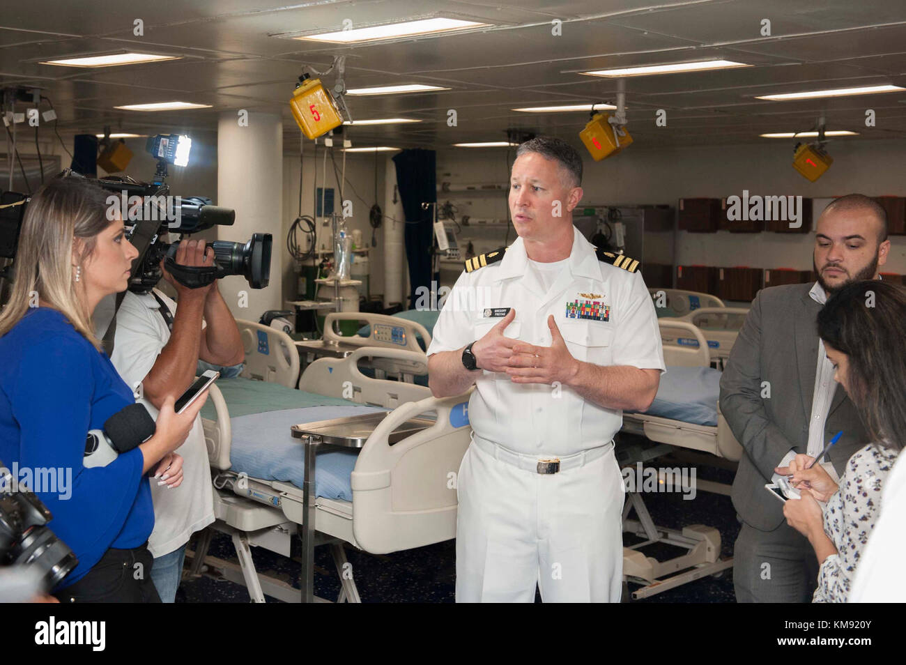 Cmdr. Gregory Freitag describes features of the medical department ...