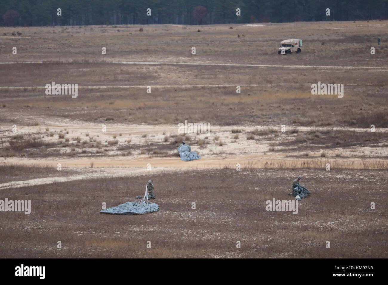 U.S. Army Paratroopers retrieve their MC-6 parachute at Sicily Drop ...