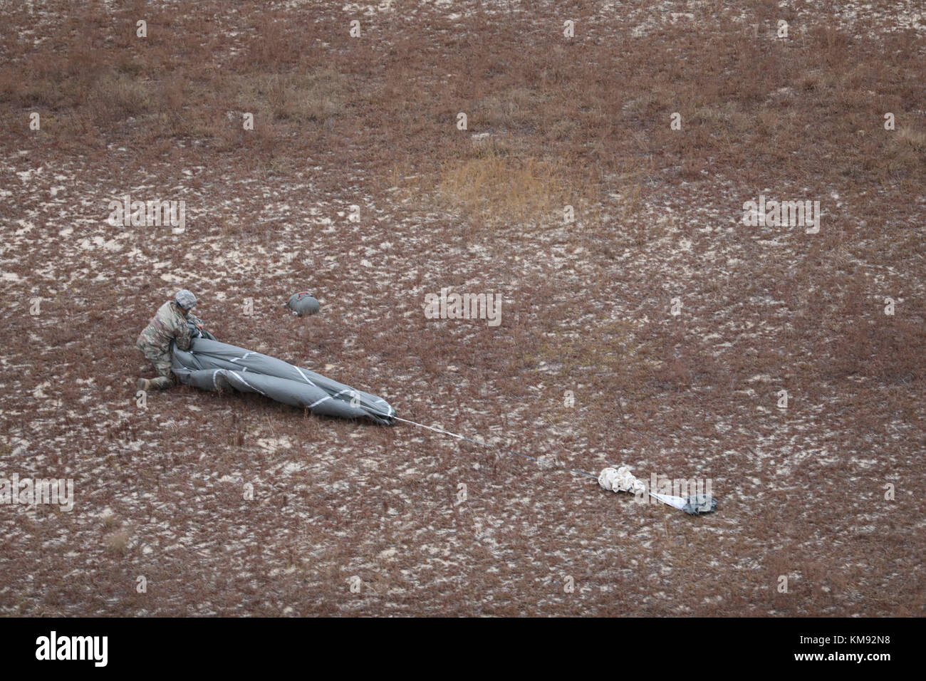 U.S. Army Paratroopers retrieve their MC-6 parachute at Sicily Drop ...