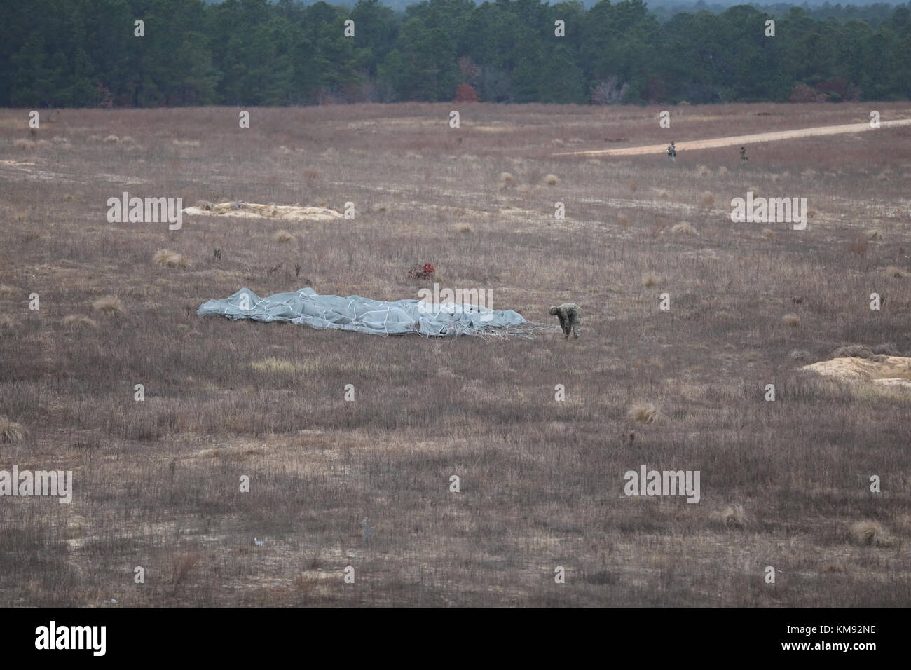 U.S. Army Paratroopers retrieve their MC-6 parachute at Sicily Drop ...