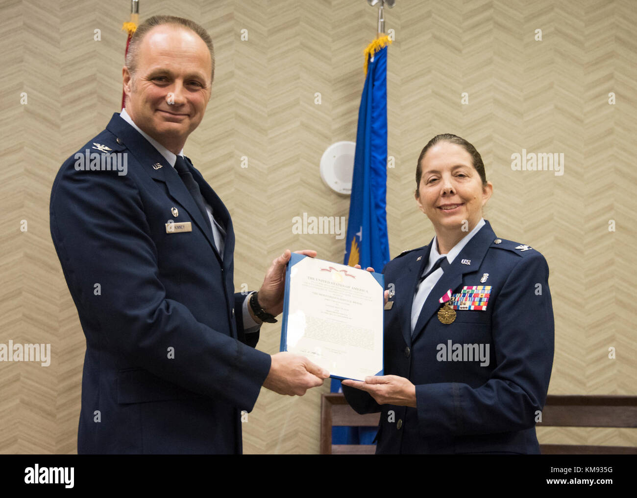 Col. Robert I. Kinney, Commander 188th Wing, presents Col. Misty M ...