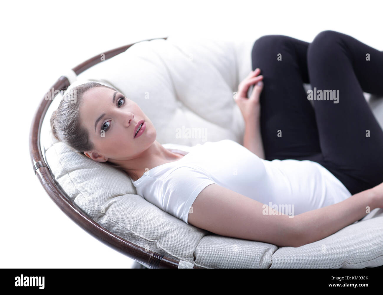 tired woman resting in an easy chair made of rattan Stock Photo - Alamy