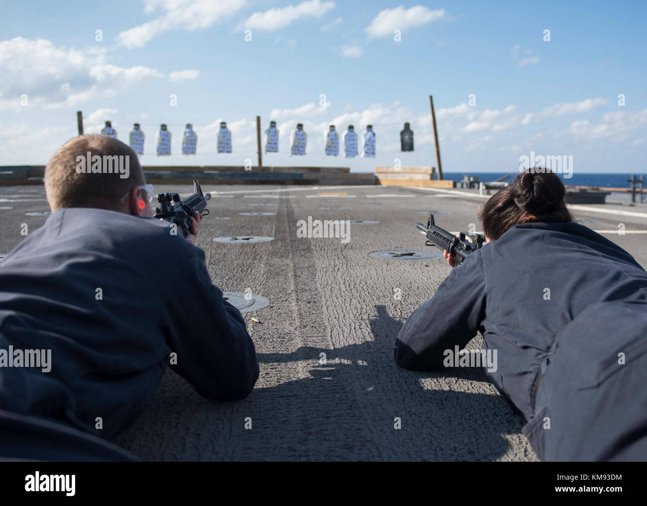 Chief Gunner's Mate Wade Jump (left) and Electronics Technician Emily ...
