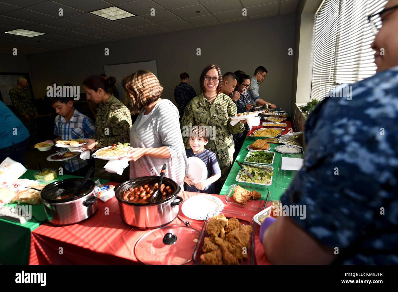Sailors and their family members get to enjoy the annual potluck held ...