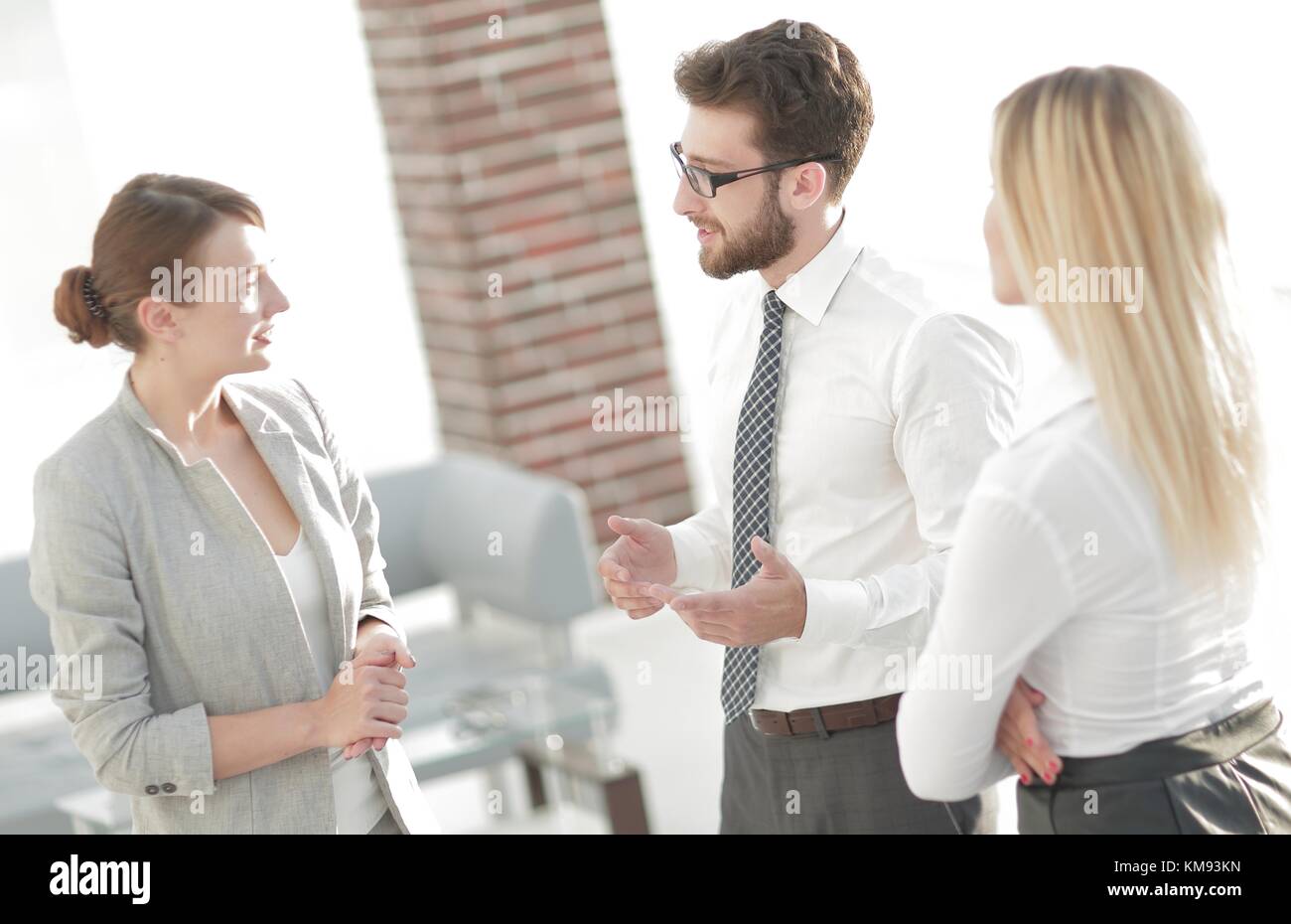 Manager and business team talking in the office Stock Photo - Alamy
