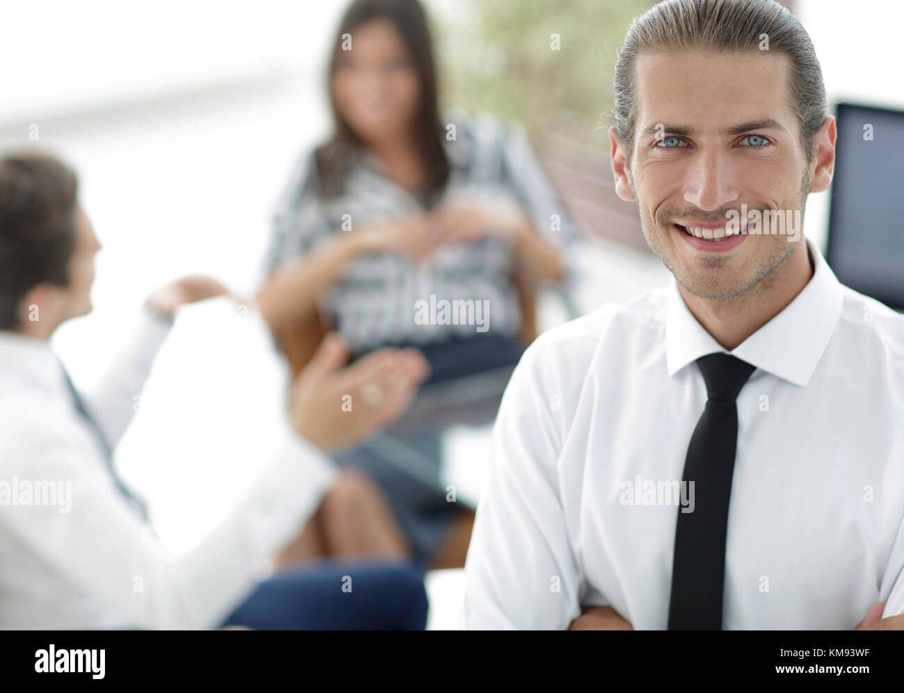 successful young business men on blurred background Stock Photo - Alamy