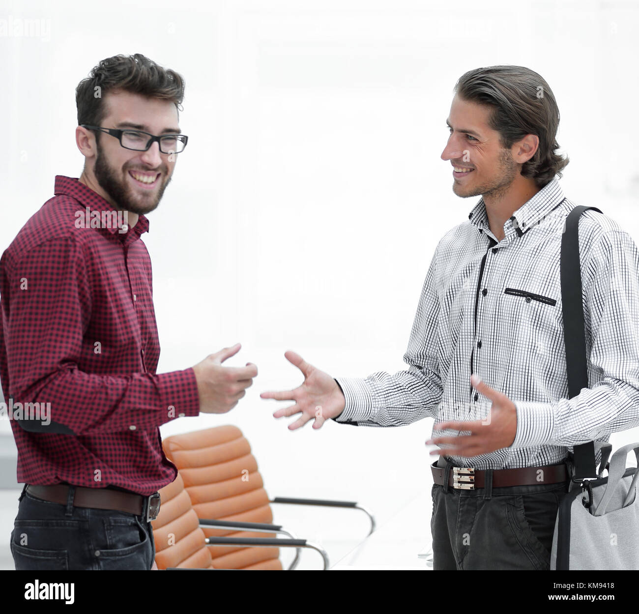two employees are talking in the office Stock Photo - Alamy