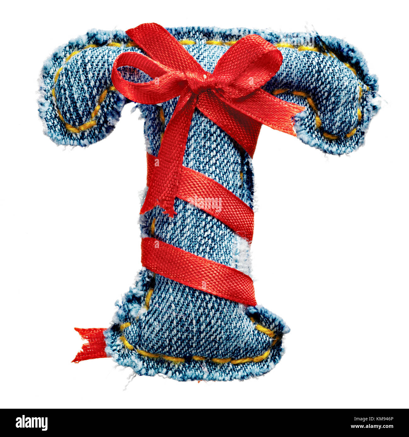 Magic holiday jeans alphabet letter T with red ribbon Stock Photo - Alamy
