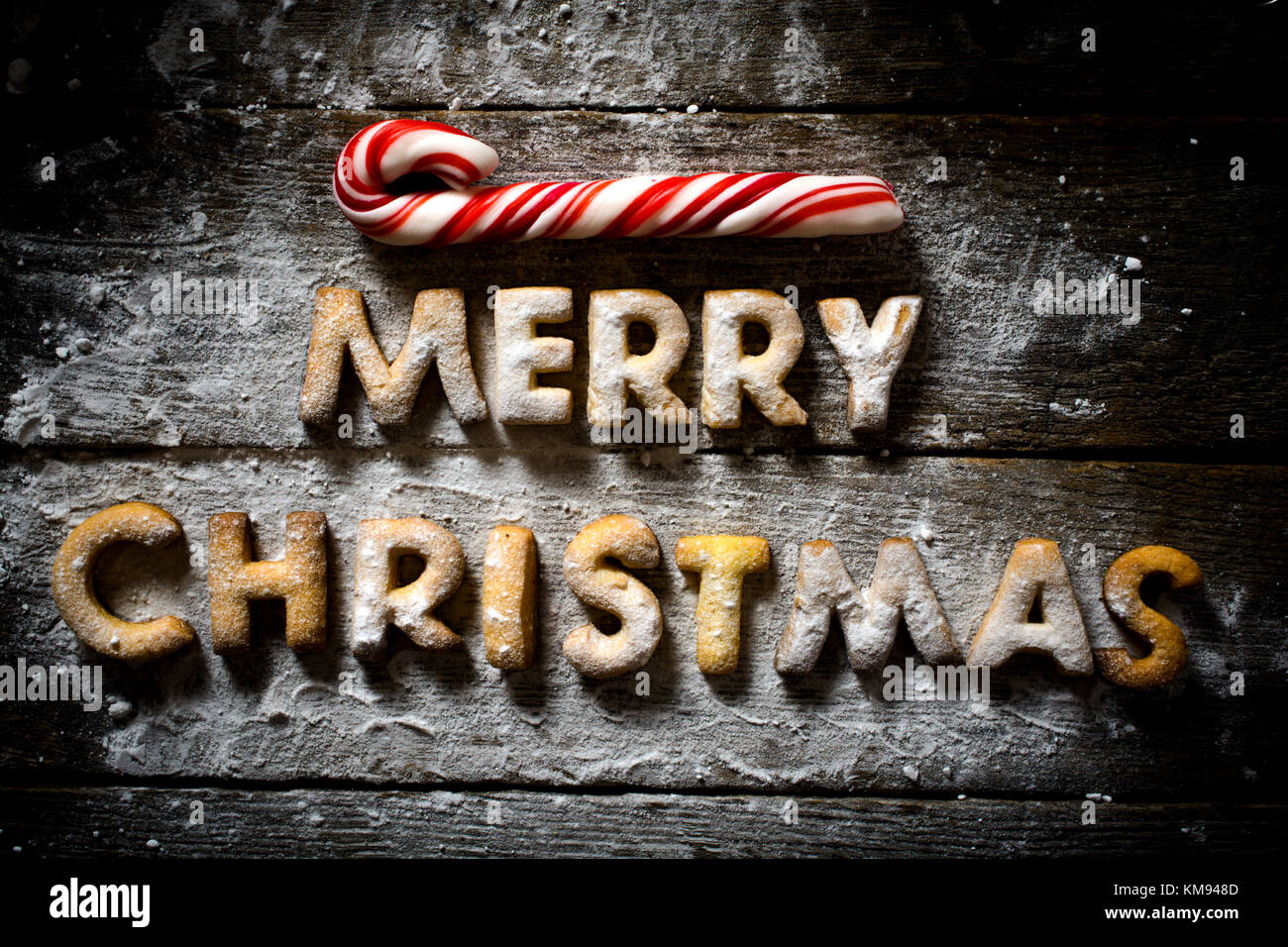 Merry Christmas cookies and traditional red and white candy on the ...