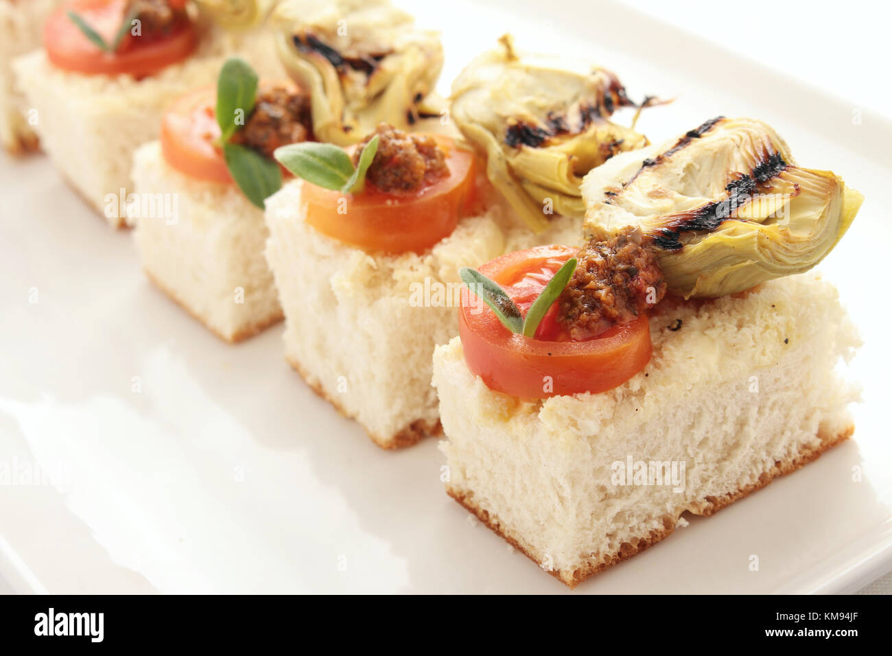 artichoke tomato pesto canapes Stock Photo - Alamy