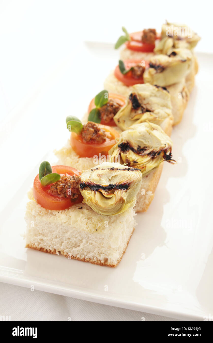 artichoke tomato pesto canapes Stock Photo - Alamy