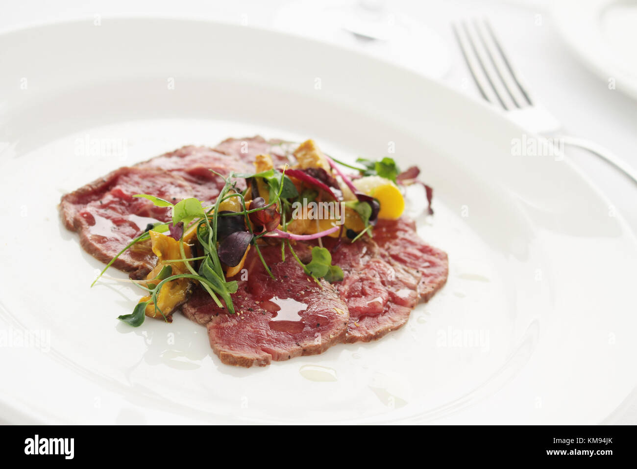 beef carpaccio plated appetizer starter Stock Photo - Alamy