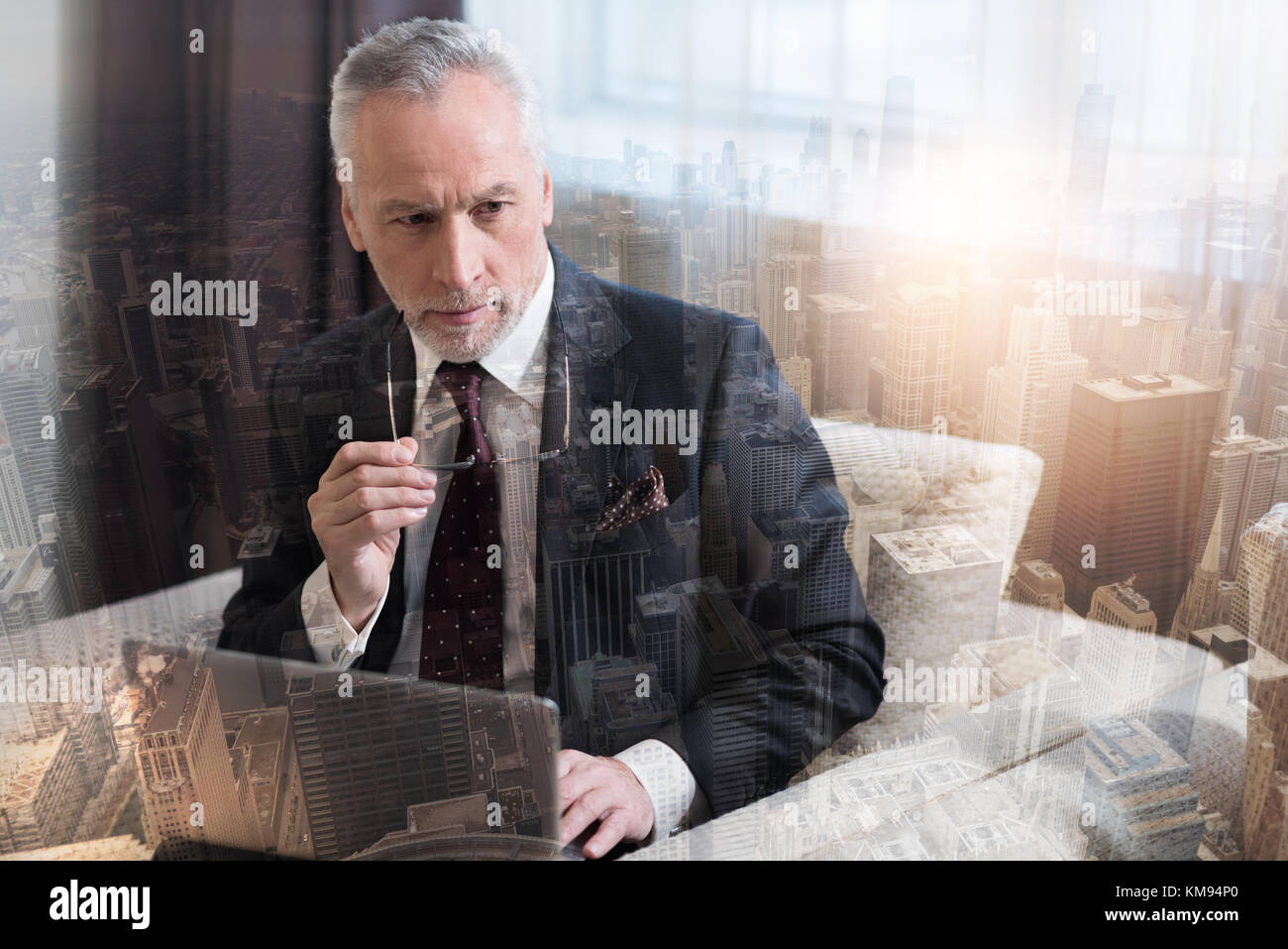 Concentrated male entrepreneur thinking about new business strategy ...