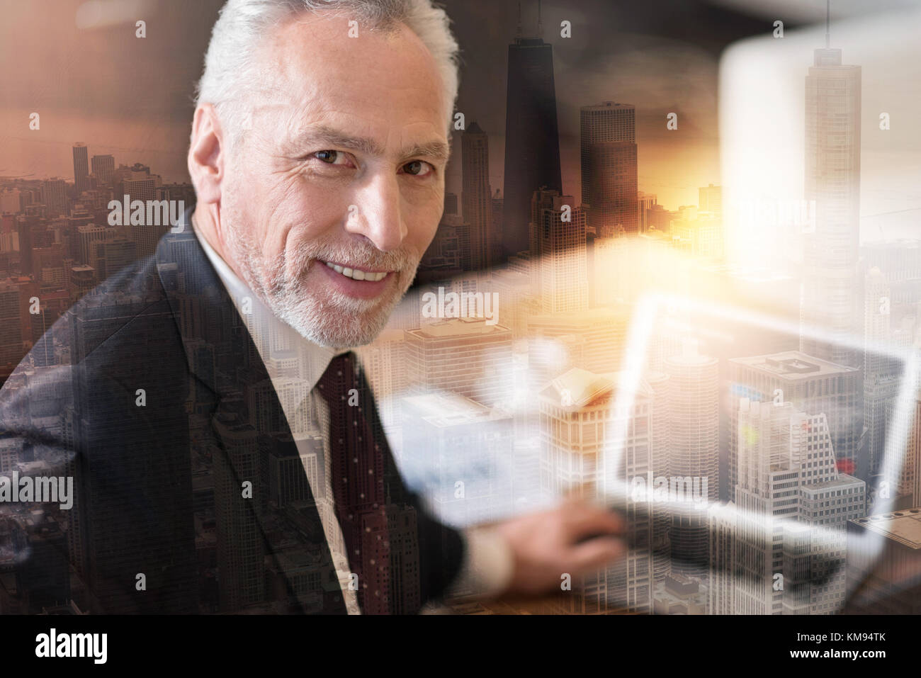 Cheerful businessman smiling into camera Stock Photo - Alamy