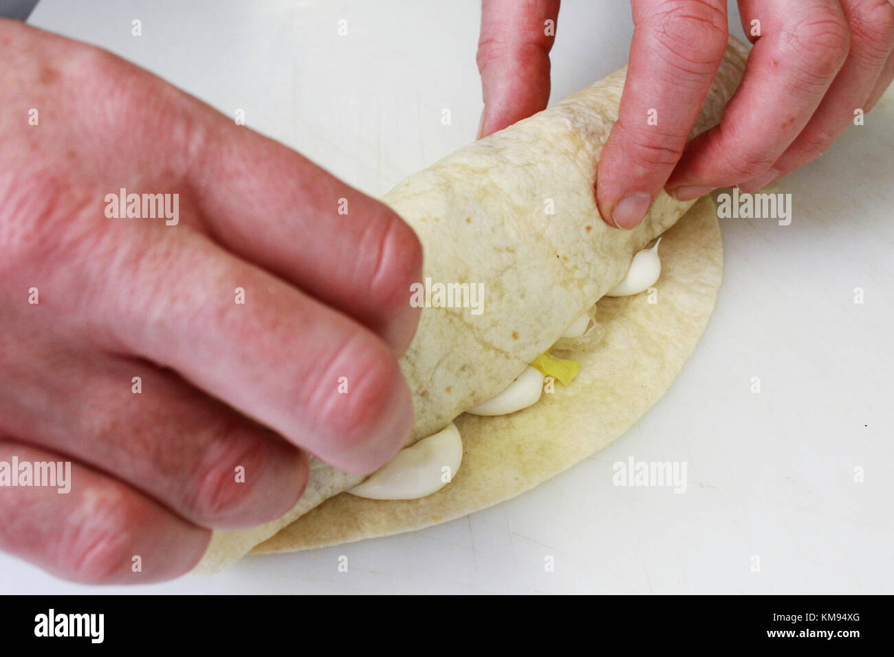 chef preparing chicken wrap Stock Photo - Alamy