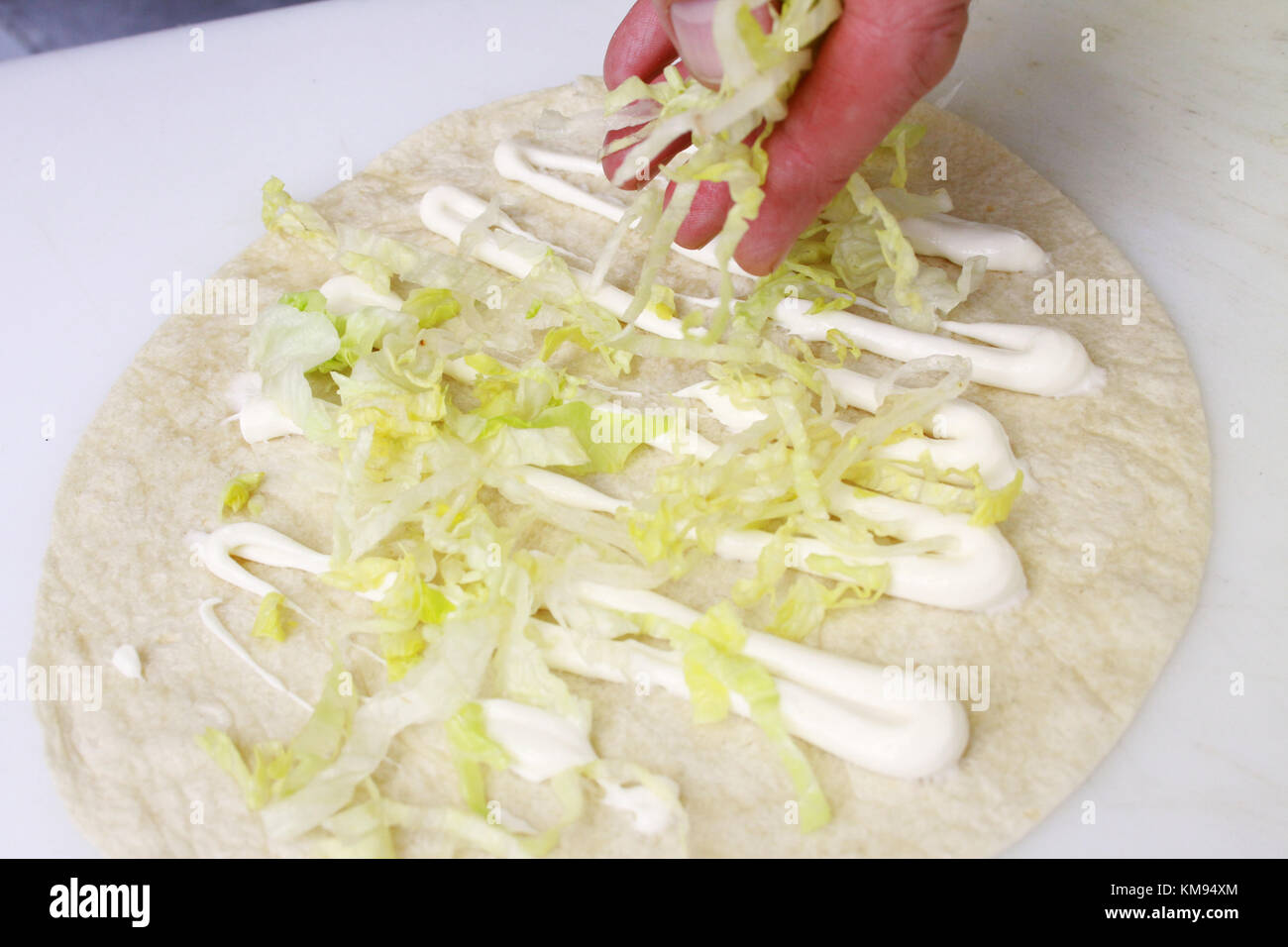 chef preparing chicken wrap Stock Photo - Alamy