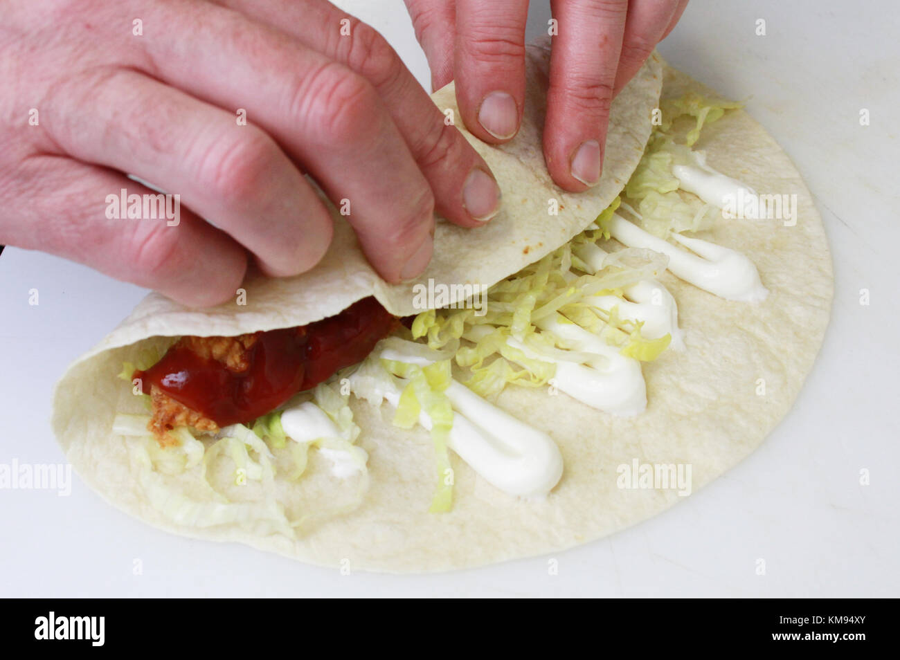 chef preparing chicken wrap Stock Photo - Alamy