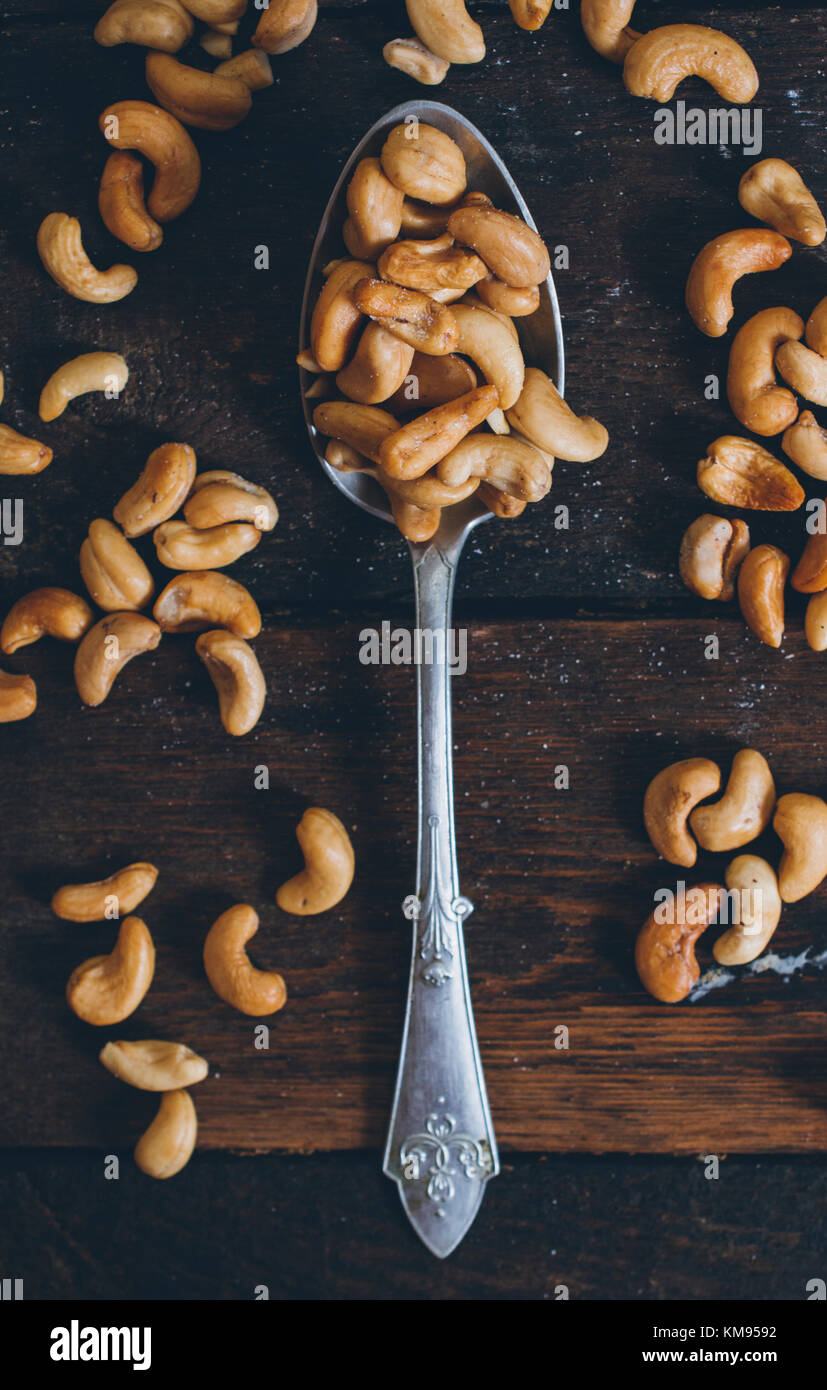 Fried cashew nuts in old vintage spoon,selective focus Stock Photo - Alamy