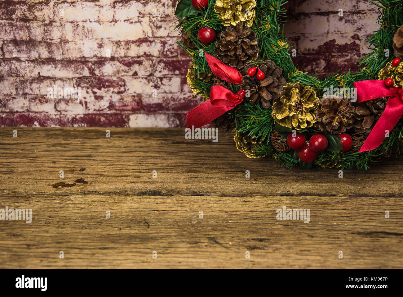 christmas wreath on brick wall background Stock Photo - Alamy