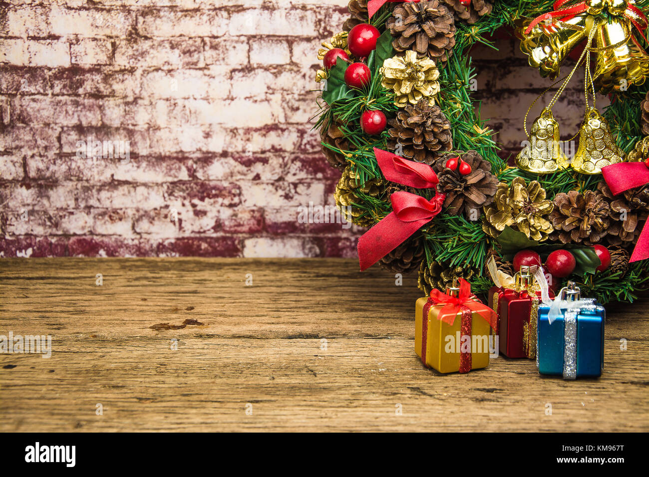 christmas wreath on brick wall background Stock Photo - Alamy