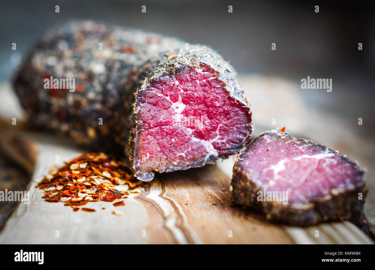 Dried Meat With Pepper And Salt On Rustic Wooden Background Stock Photo ...