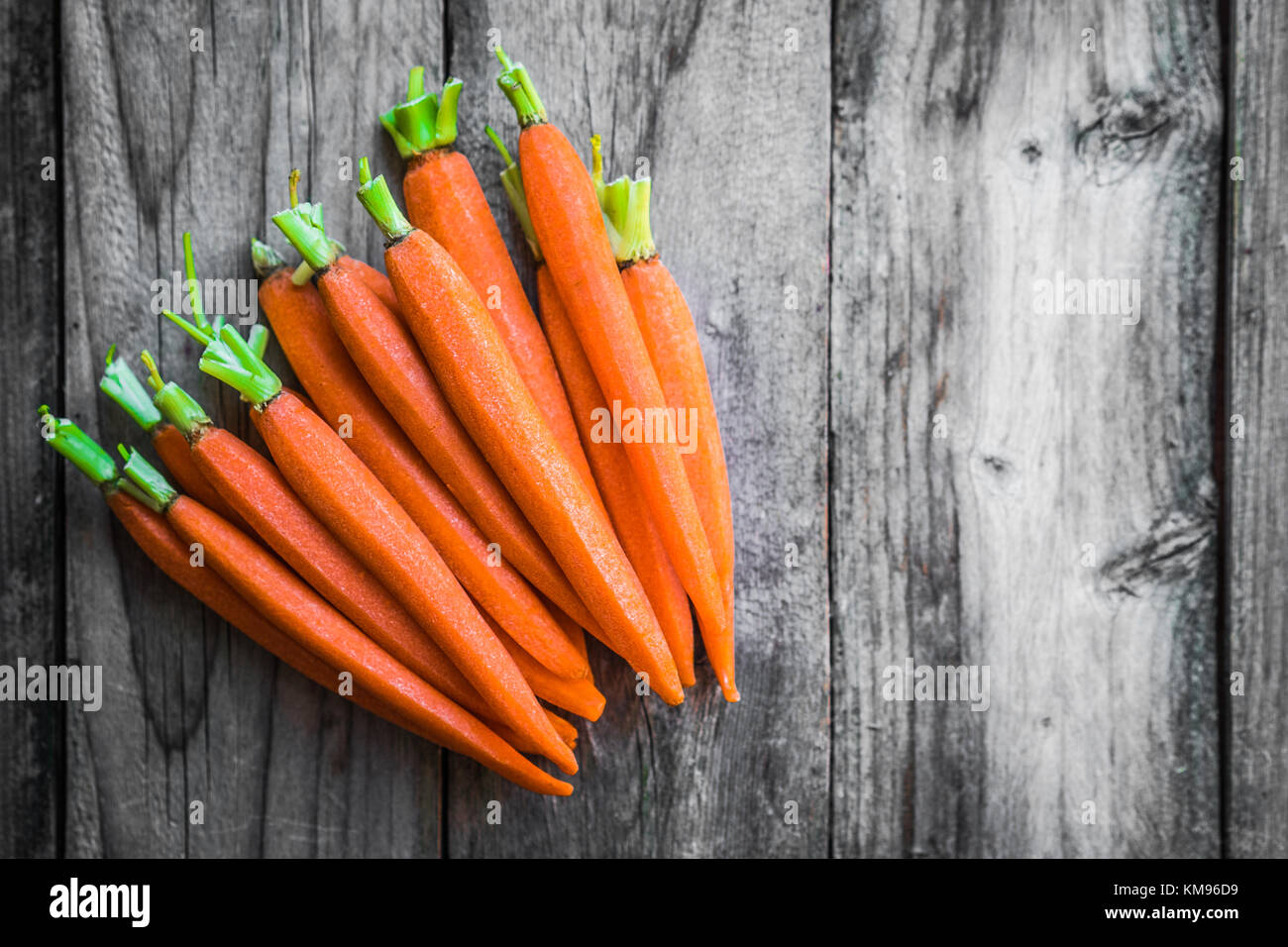 Farm raised baby carrots Stock Photo - Alamy