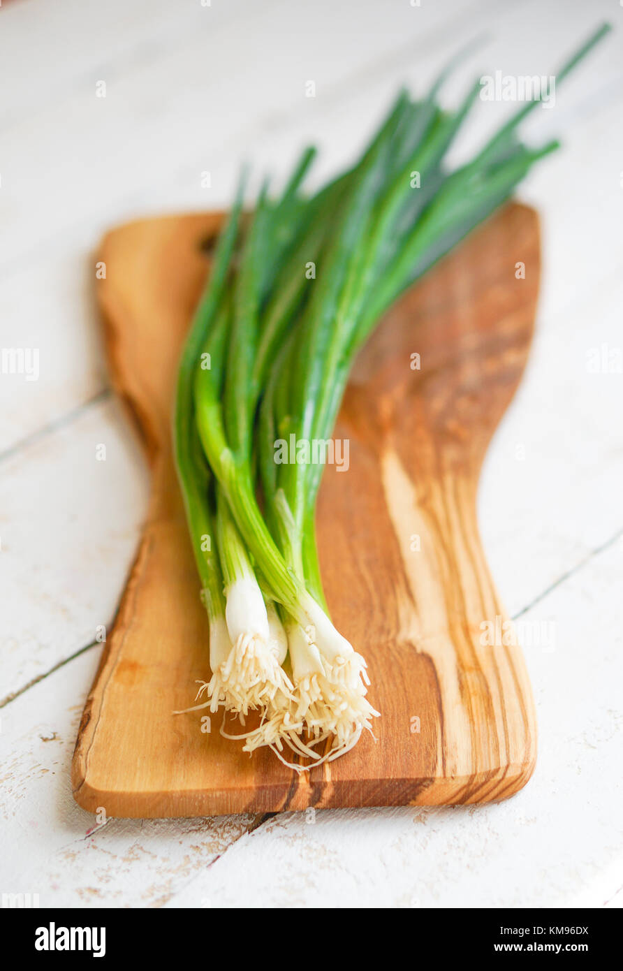 Farm Raised Organic Green Onions On Wooden Background Stock Photo - Alamy