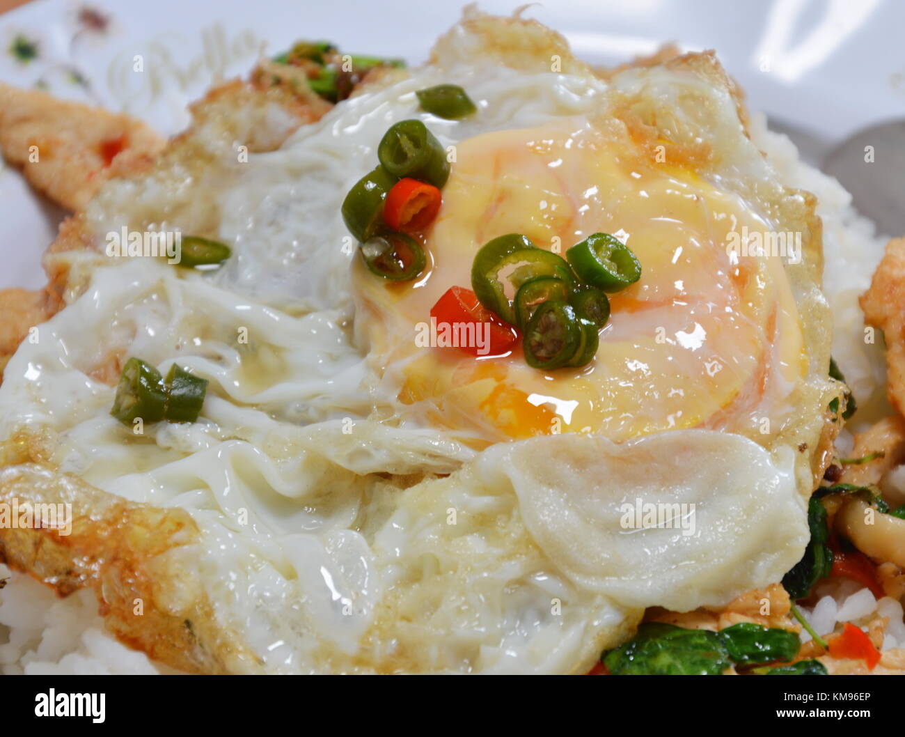 fried egg topping chop chili in fish sauce Stock Photo - Alamy