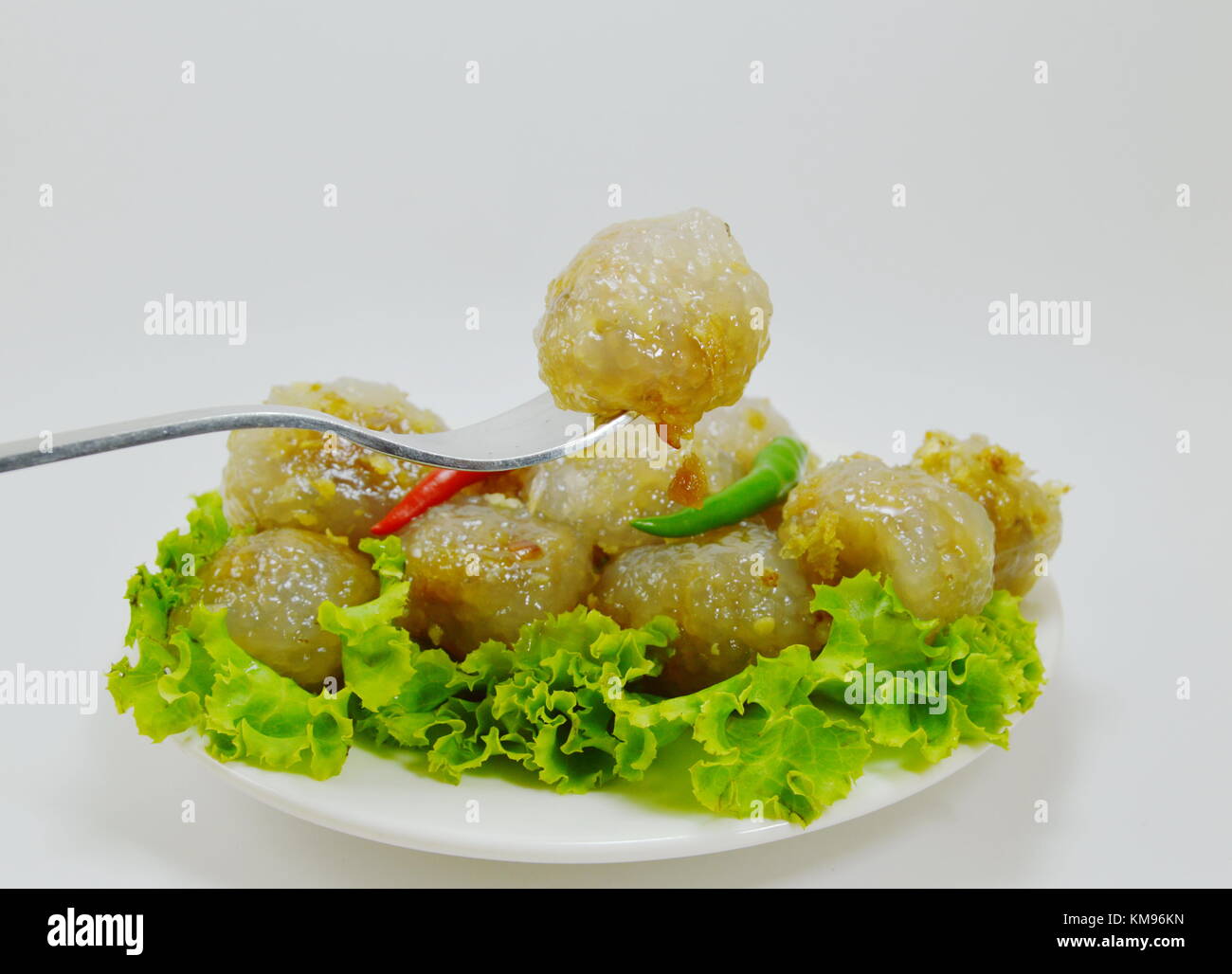 tapioca balls with pork filling on fork Stock Photo - Alamy