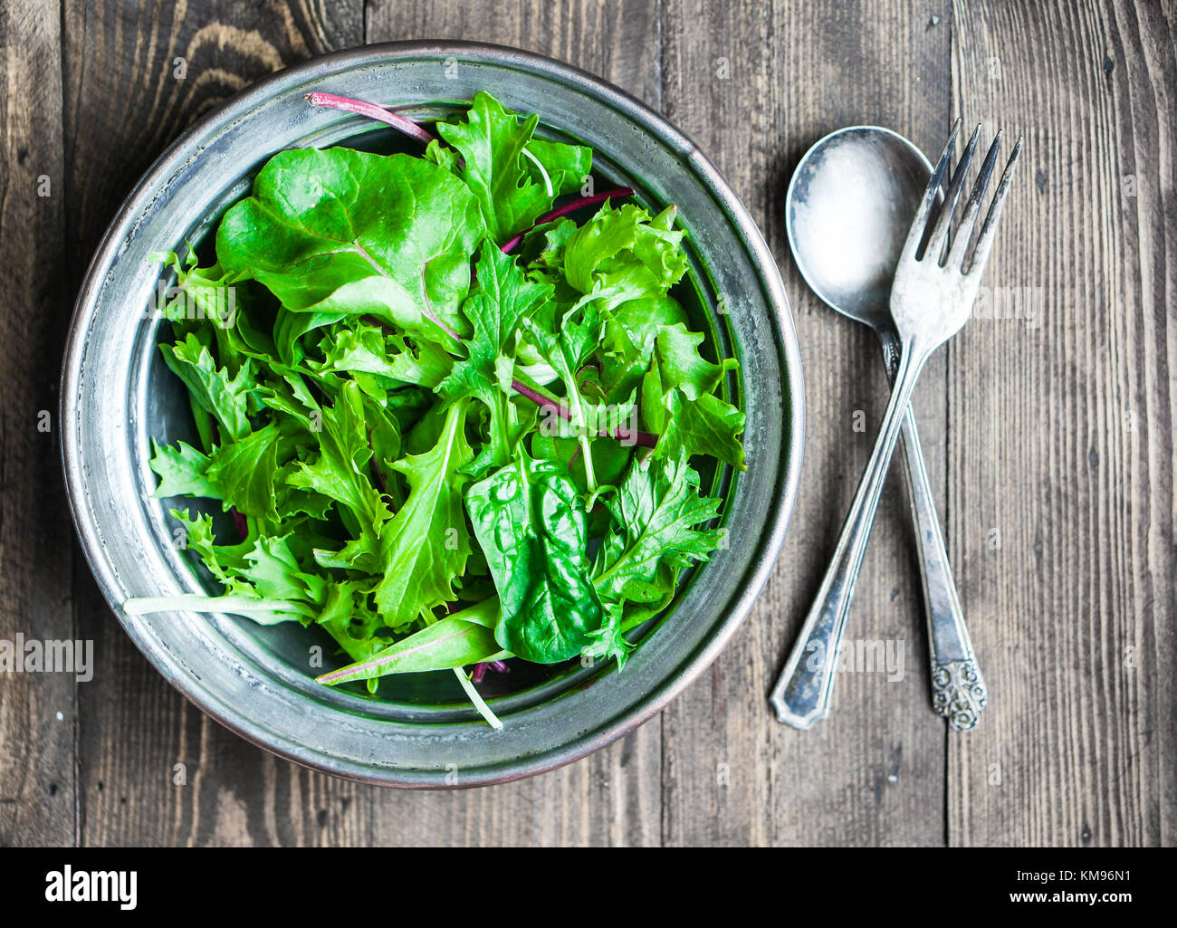 Green Salad On Rustic Background Stock Photo - Alamy
