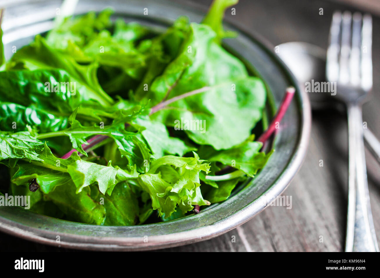 Green Salad On Rustic Background Stock Photo - Alamy