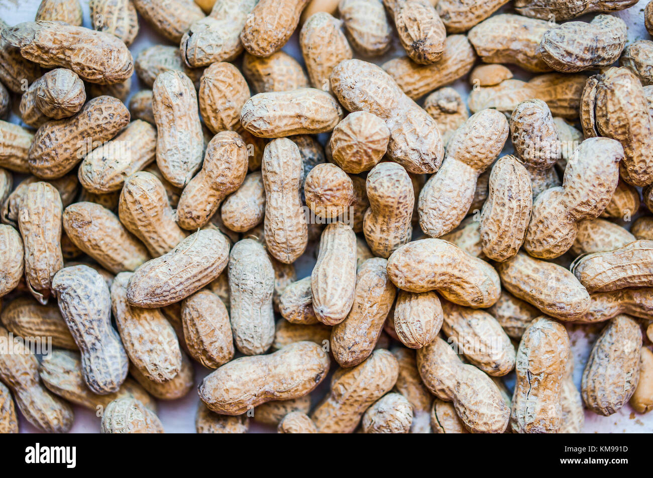 Roasted Peanuts On White Wooden Background Stock Photo - Alamy