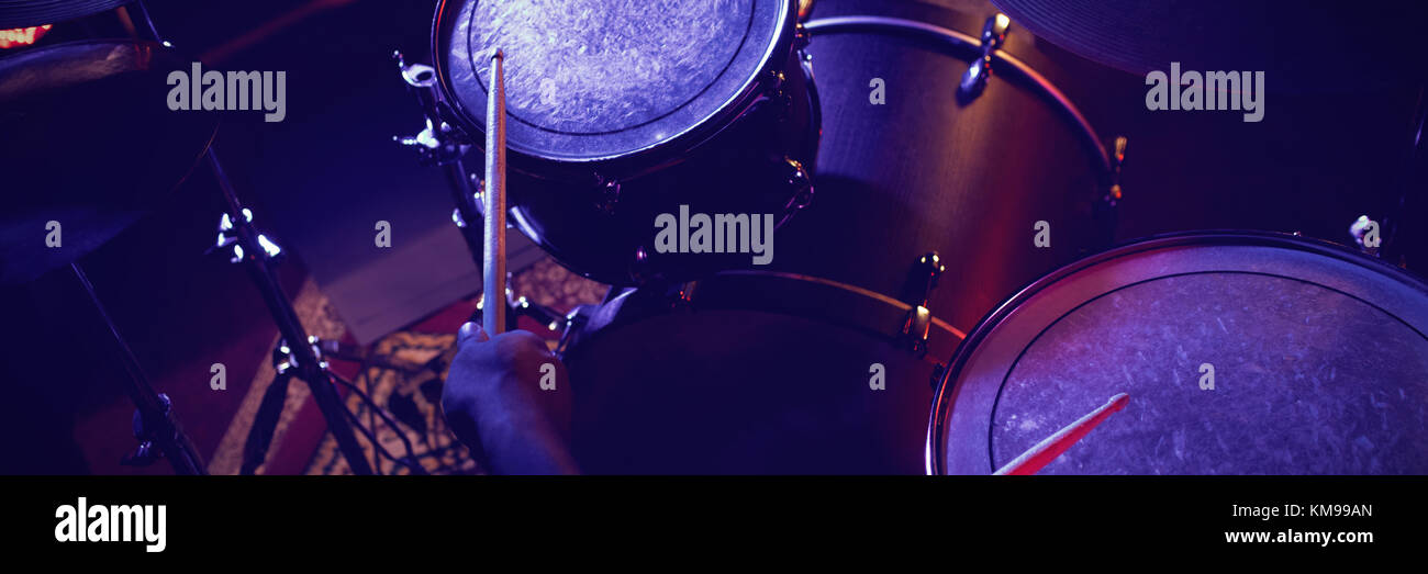 Cropped hands of drummer playing drum kit in nightclub Stock Photo - Alamy