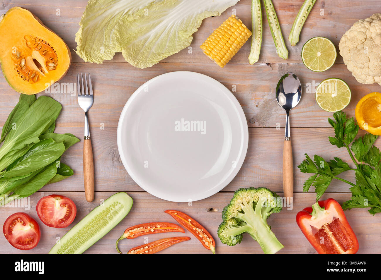 Food and sheet of paper with a diet plan on a dark wooden table ...
